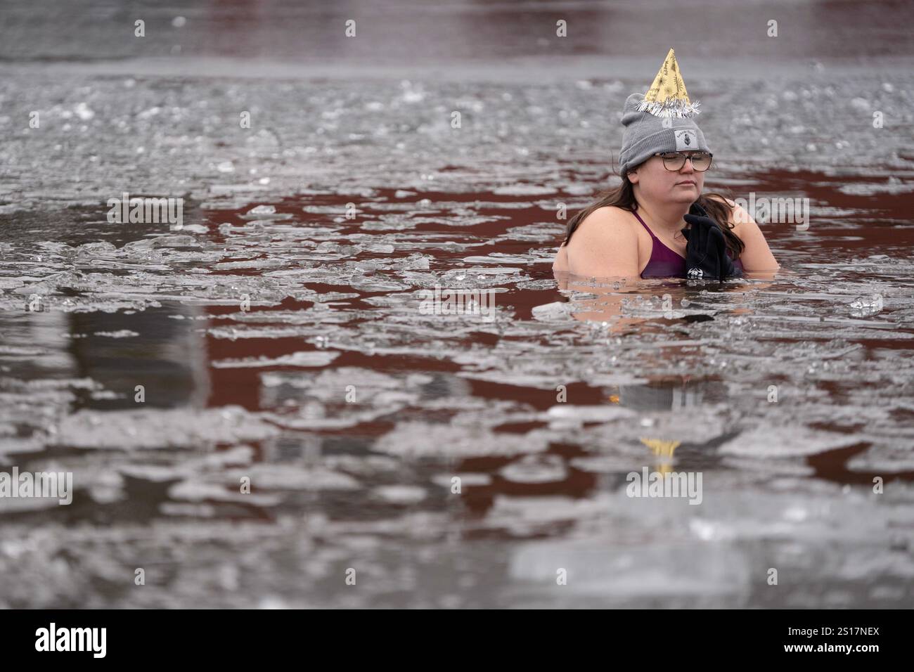 Dartmouth, Canada. 01st Jan, 2025. A person wears a party hat while ...