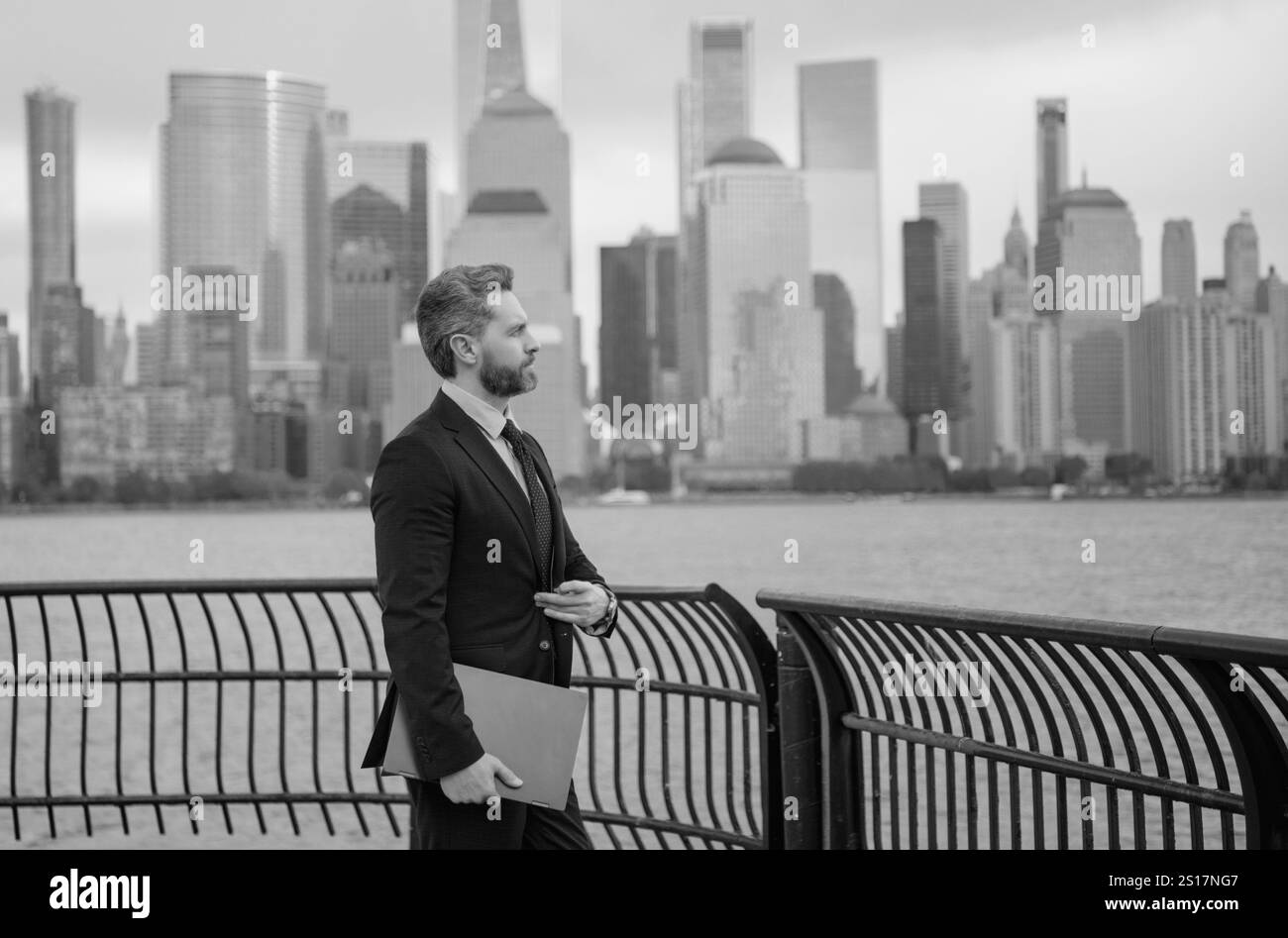 Office employee typing on laptop Black and White Stock Photos & Images ...