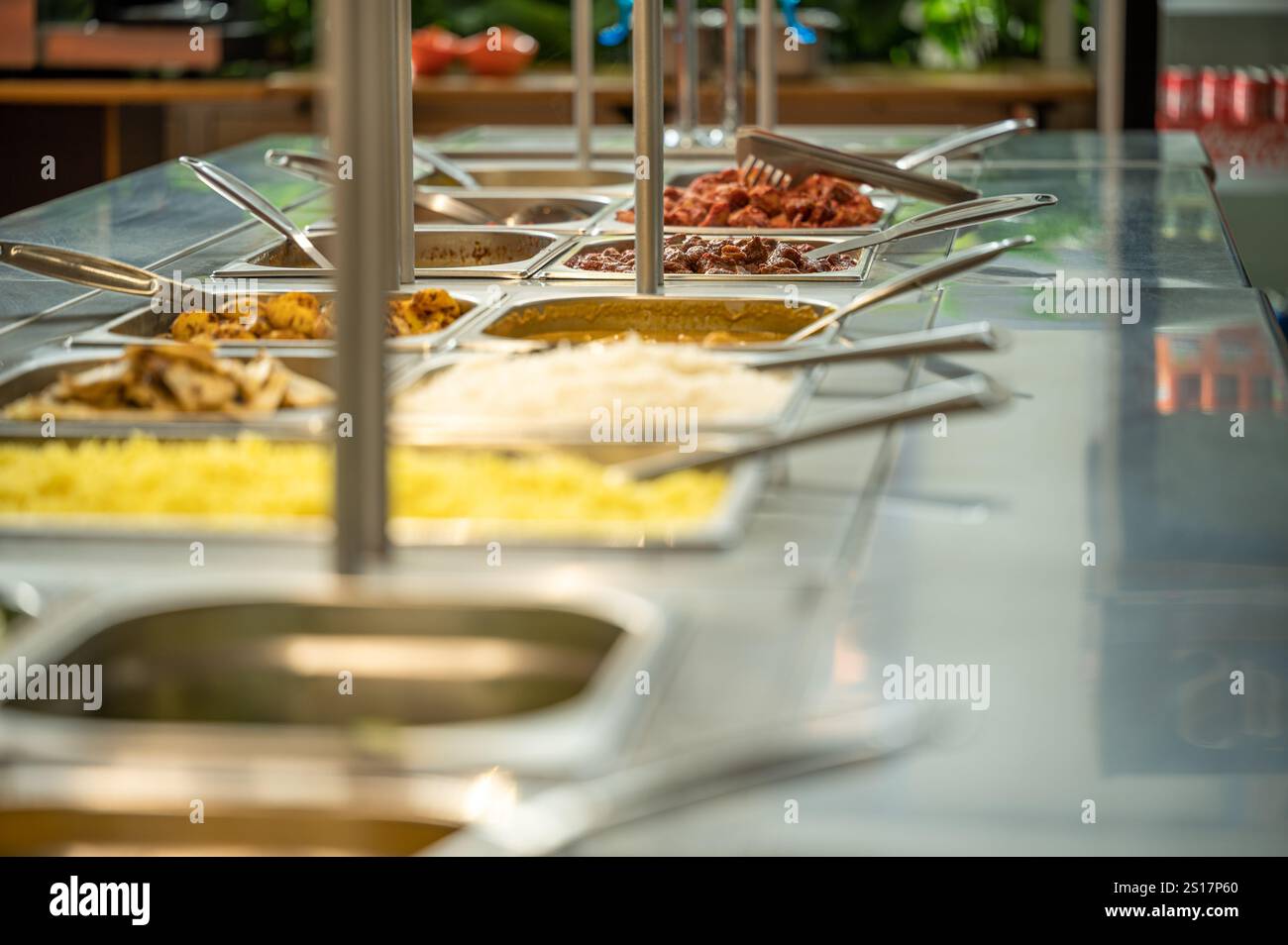 Asian food buffet in restaurant multiple food dishes and salad. Eat as ...