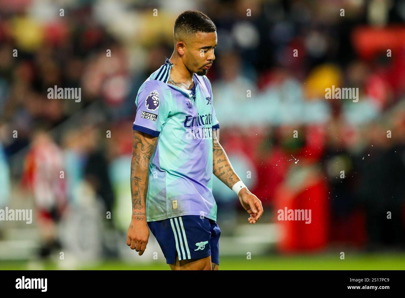 Gabriel Jesus of Arsenal leaves the field with a ripped shirt during ...