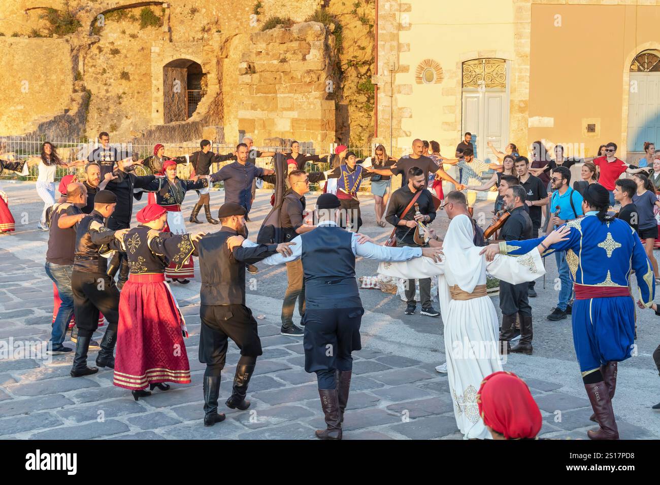 Group of people performing traditional Greek dance, Chania, Crete ...