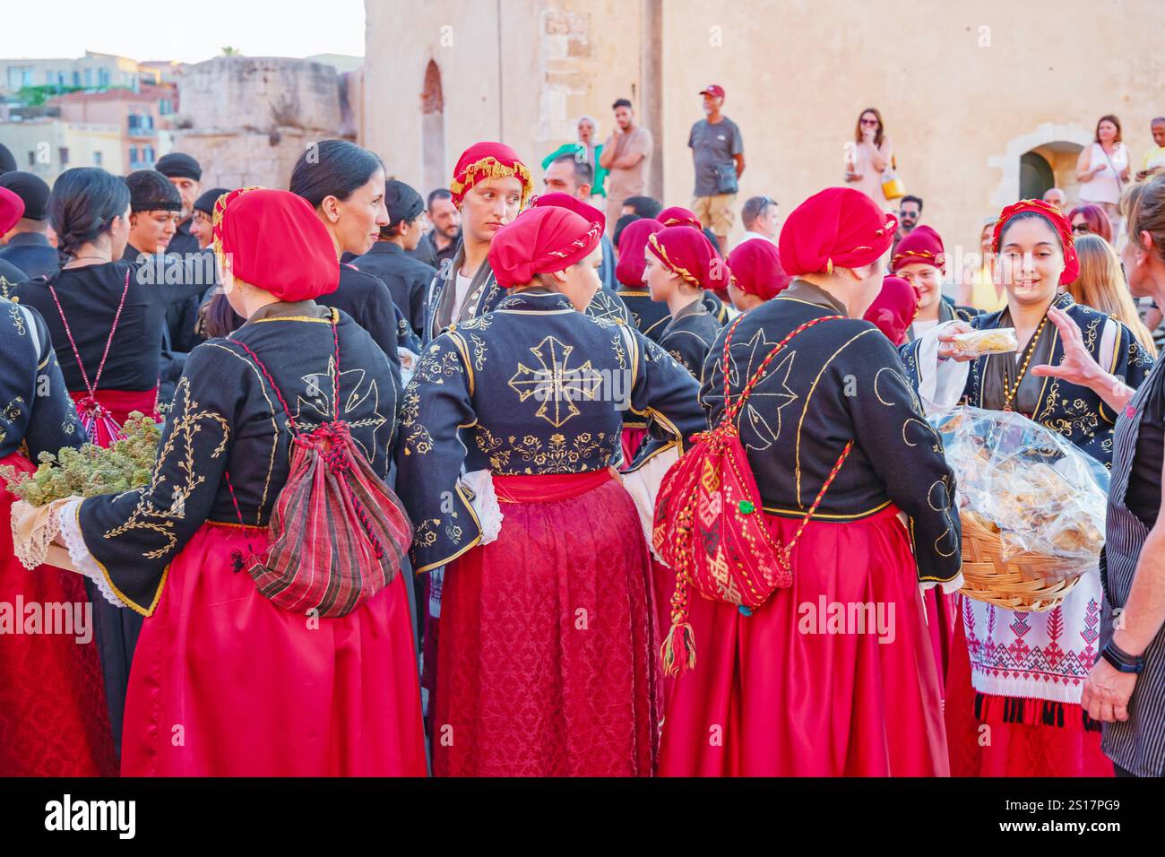 Traditionally dressed Greek women carrying gifts during marriage ...