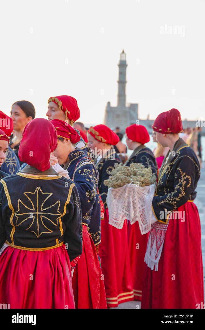 Traditionally dressed Greek women carrying gifts during marriage ...