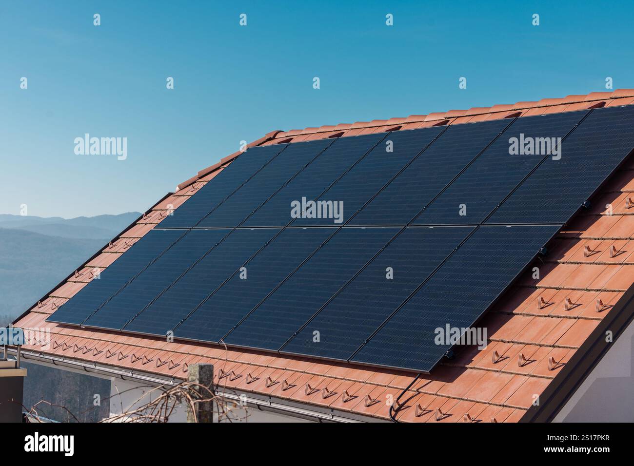 Multiple solar panels for electricity installed on a red tile wall of ...