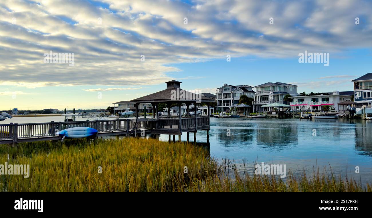 A beautiful, scenic waterfront featuring a gazebo surrounded by ...