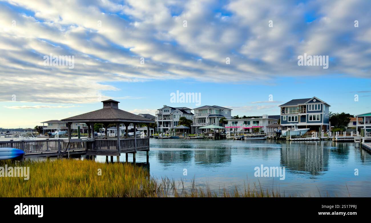 A beautiful, scenic waterfront featuring a gazebo surrounded by ...