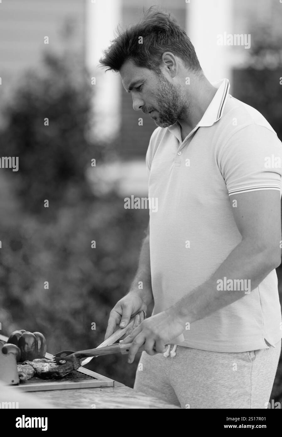 Grill cook. Chef with BBQ cooking tools. Barbecue and grill. Picnic and ...