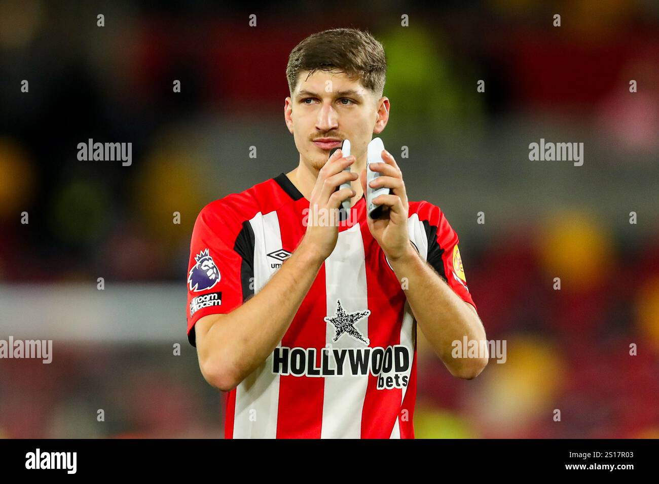 Vitaly Janelt of Brentford acknowledges the fans after the teams defeat ...
