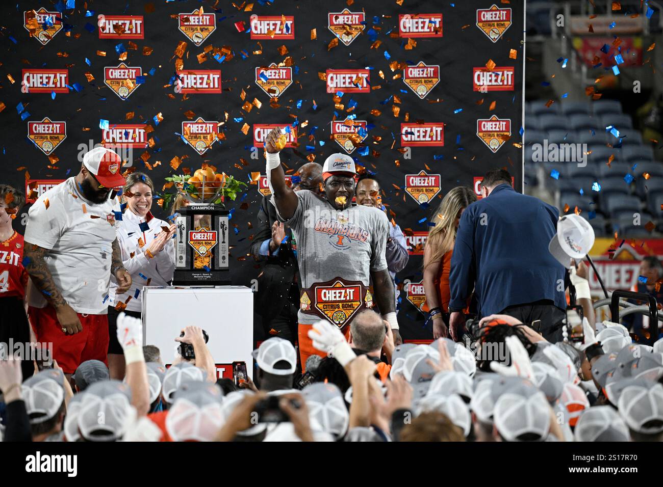 Illinois MVP running back Josh McCray, center, bites an orange on the ...