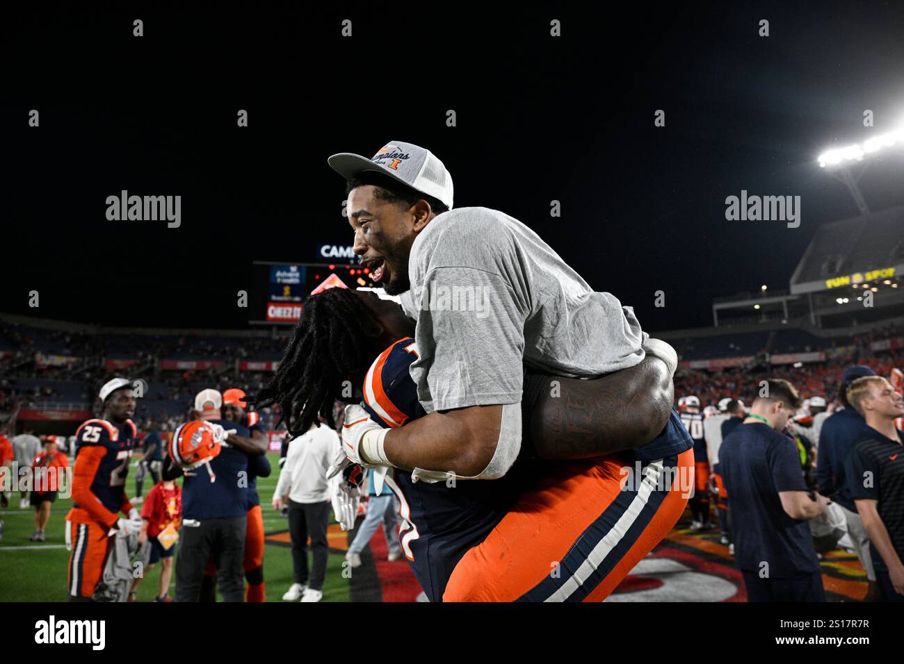 Illinois defensive back Miles Scott, right, and linebacker Gabe Jacas ...