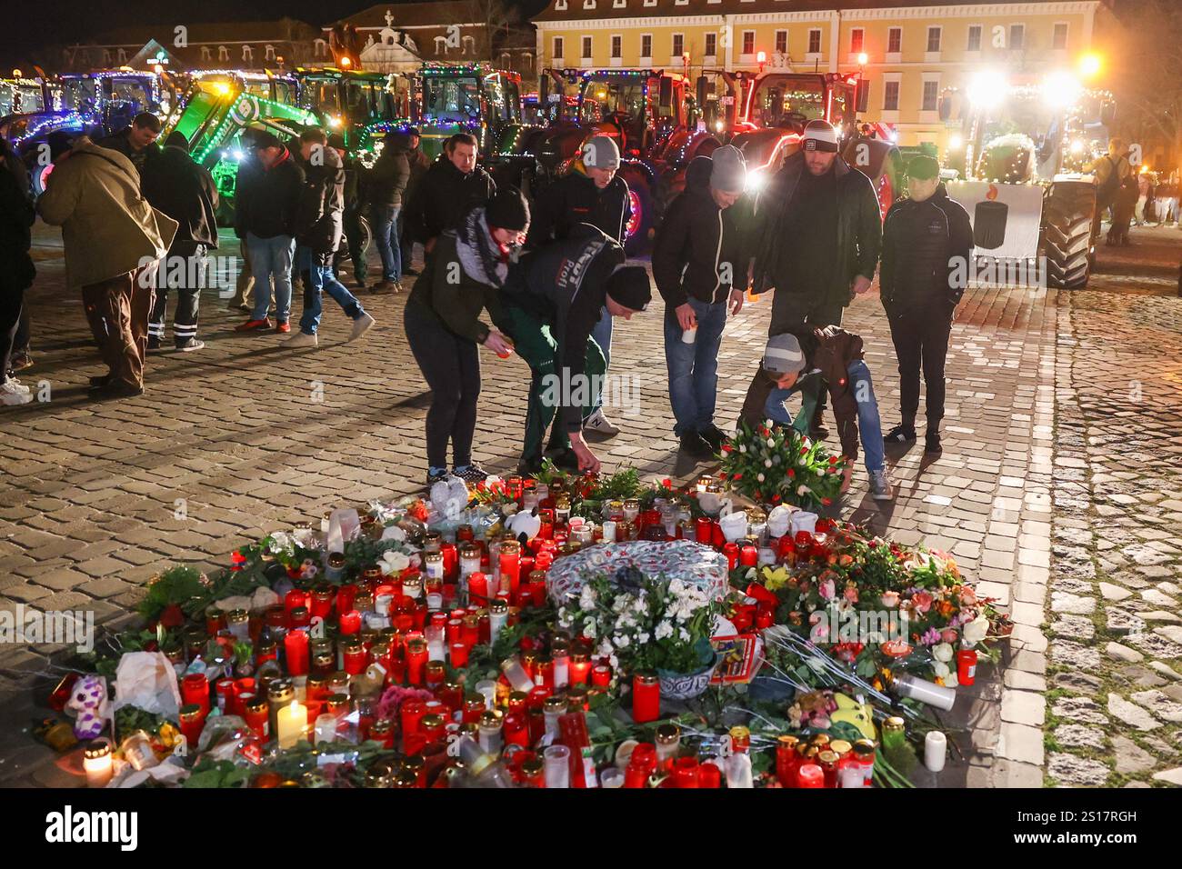 Magdeburg, Germany. 01st Jan, 2025. People lay flowers in remembrance ...