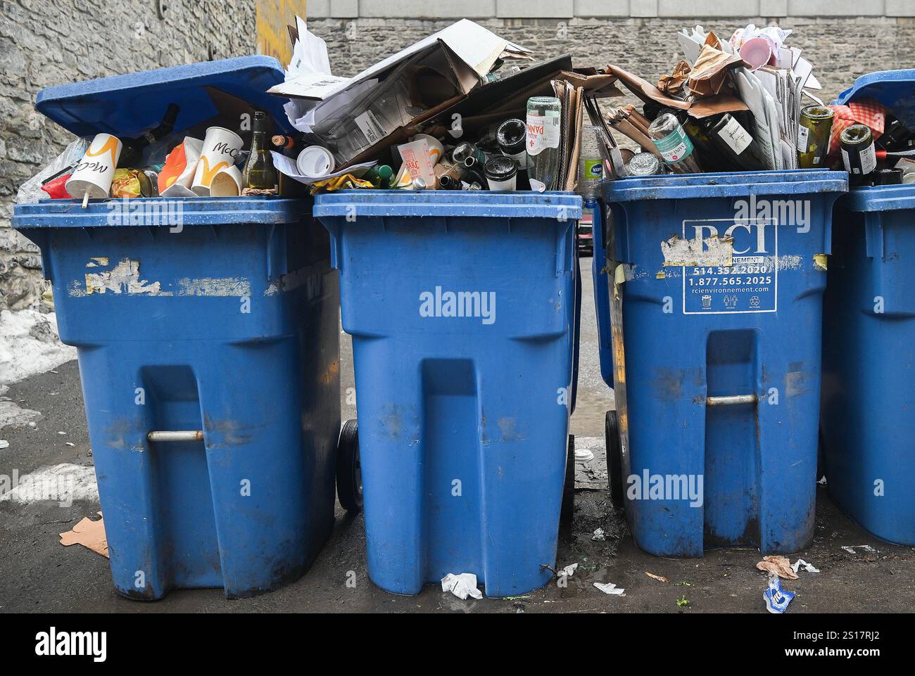 Montreal, Canada. 01st Jan, 2025. Overflowing recycling bins are shown ...