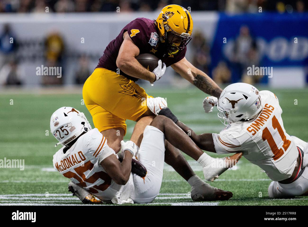 January 1, 2025: Arizona State running back Cam Skattebo (4) stiff arms ...