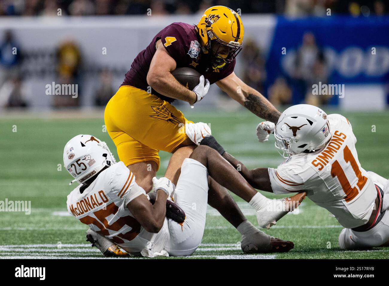 January 1, 2025: Arizona State running back Cam Skattebo (4) stiff arms ...