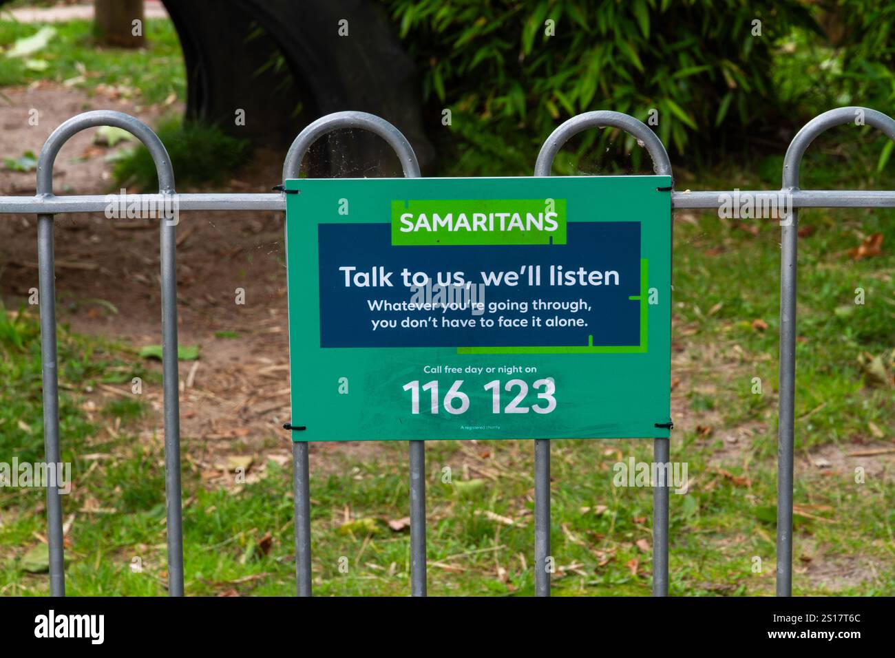 TAUNTON, ENGLAND JULY 30 2021: Sign by weir for the Samaritans with ...