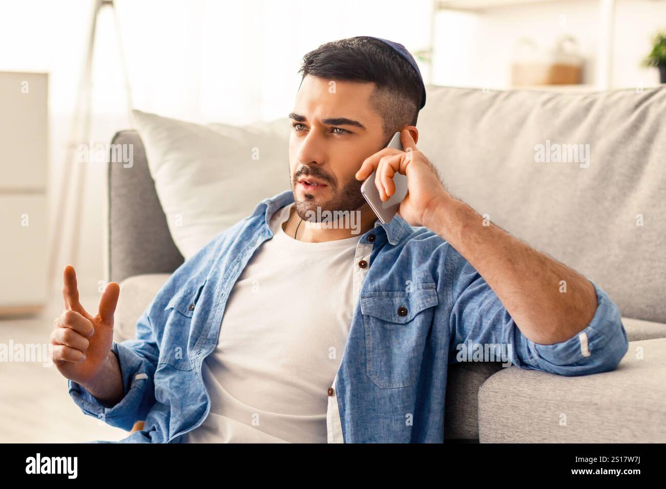 Portrait of israeli man talking on phone using pc Stock Photo - Alamy