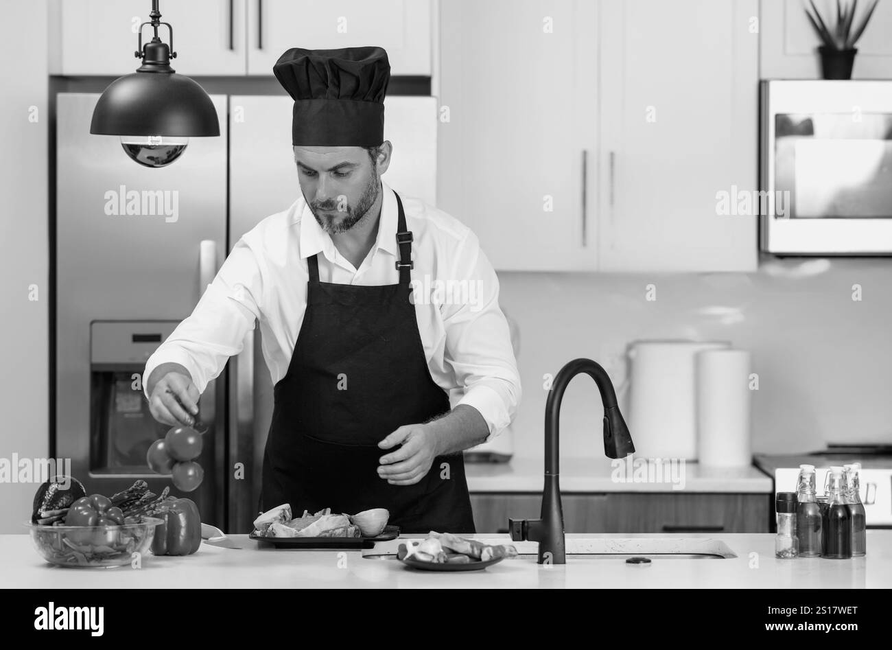 Chef mature man cook wear apron in kitchen. Handsome man preparing food ...