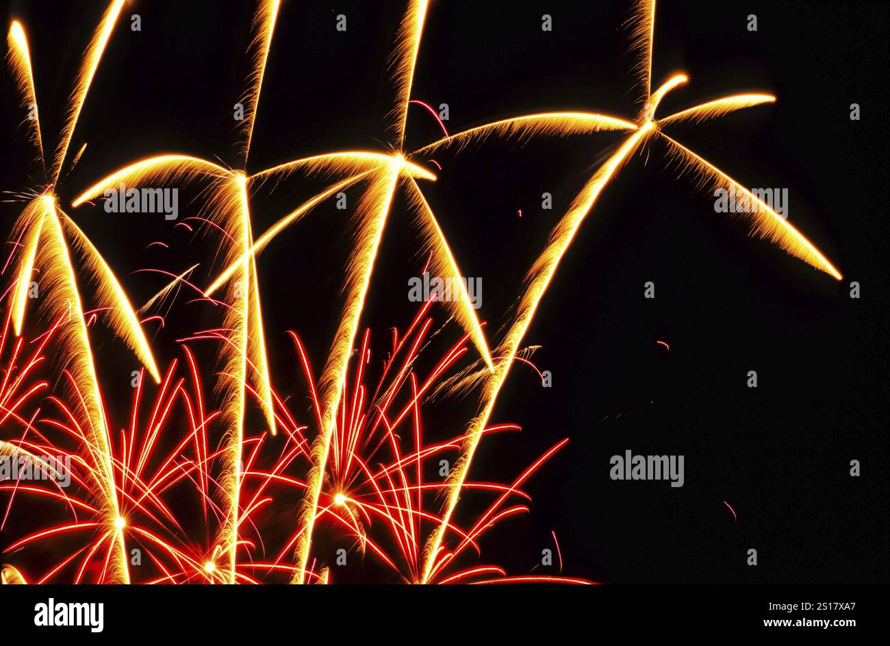 New Year's Eve fireworks, vivid fireworks in the night sky with golden ...