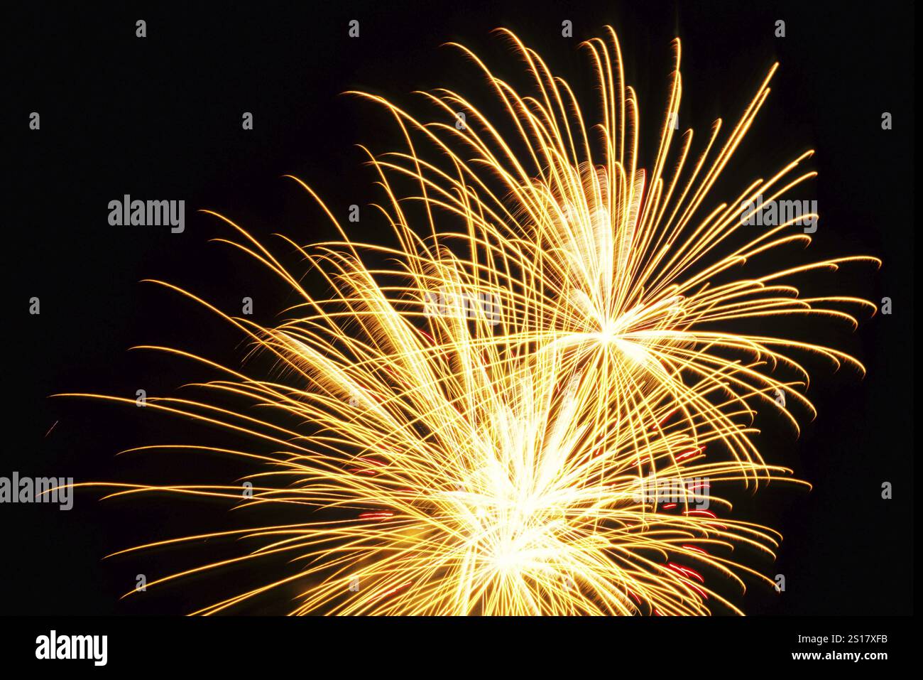 New Year's Eve fireworks, vivid fireworks in the night sky with golden ...