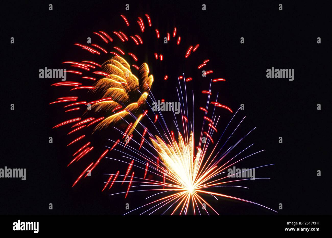 New Year's Eve fireworks, vivid fireworks in the night sky with golden ...