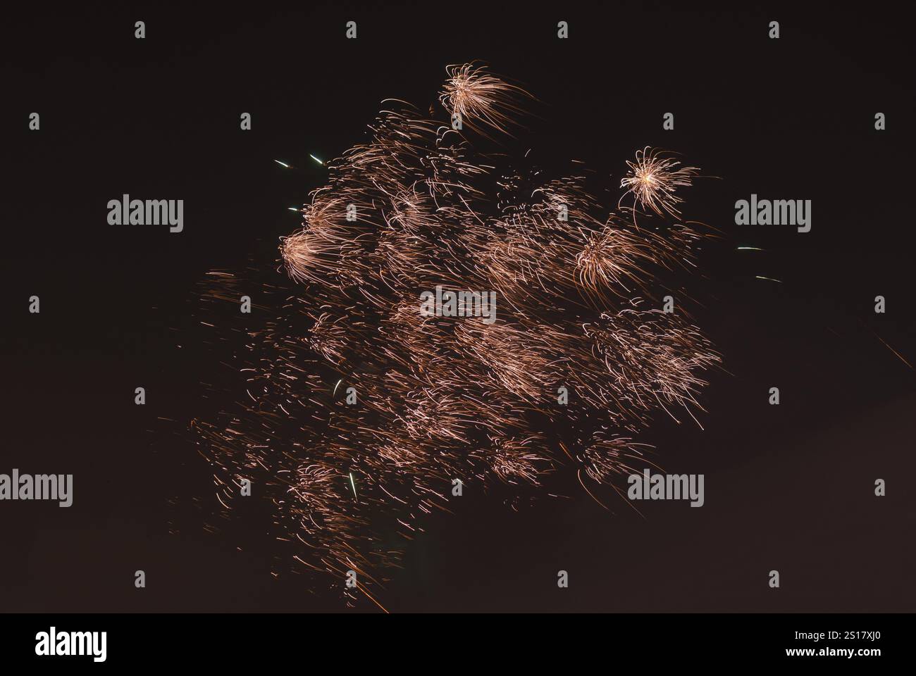 Fireworks light up the night sky with orange-coloured sparks, Lower ...