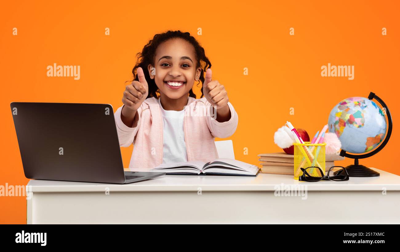 Portrait of smiling black girl student showing thumbs up Stock Photo ...
