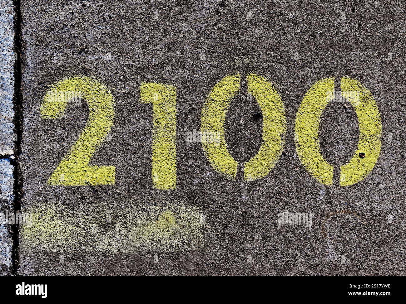 Number 2100 painted with spray paint on street concrete Stock Photo - Alamy