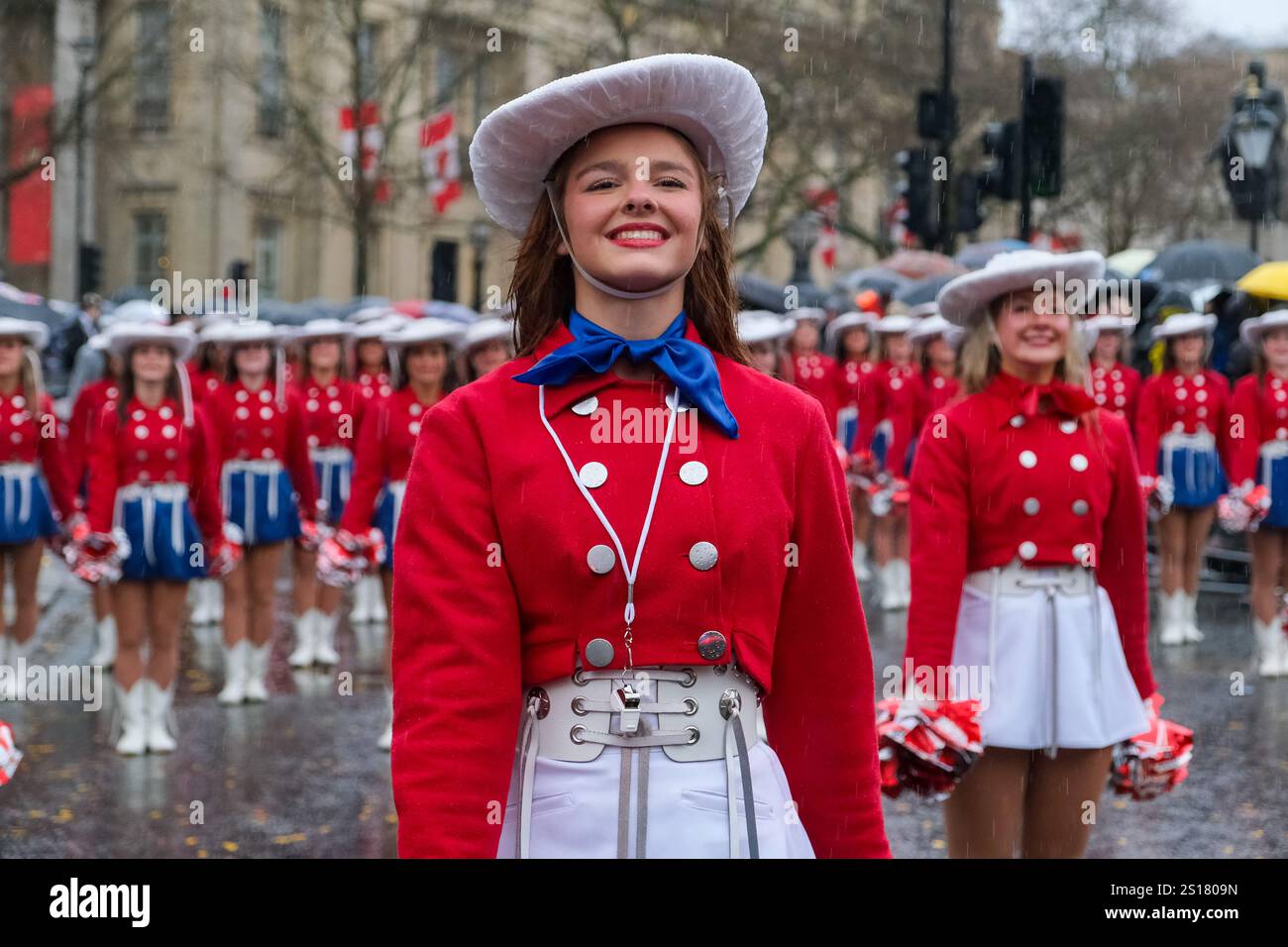 London, UK. 1st January, 2025. Performers and spectators brave the rain ...