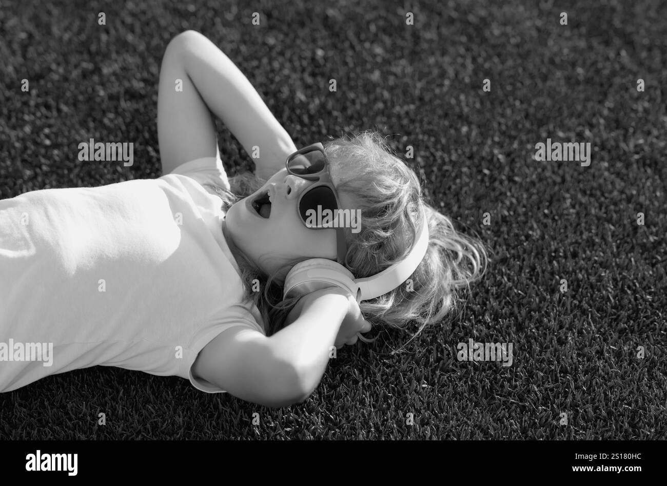 Children listening music Black and White Stock Photos & Images - Alamy