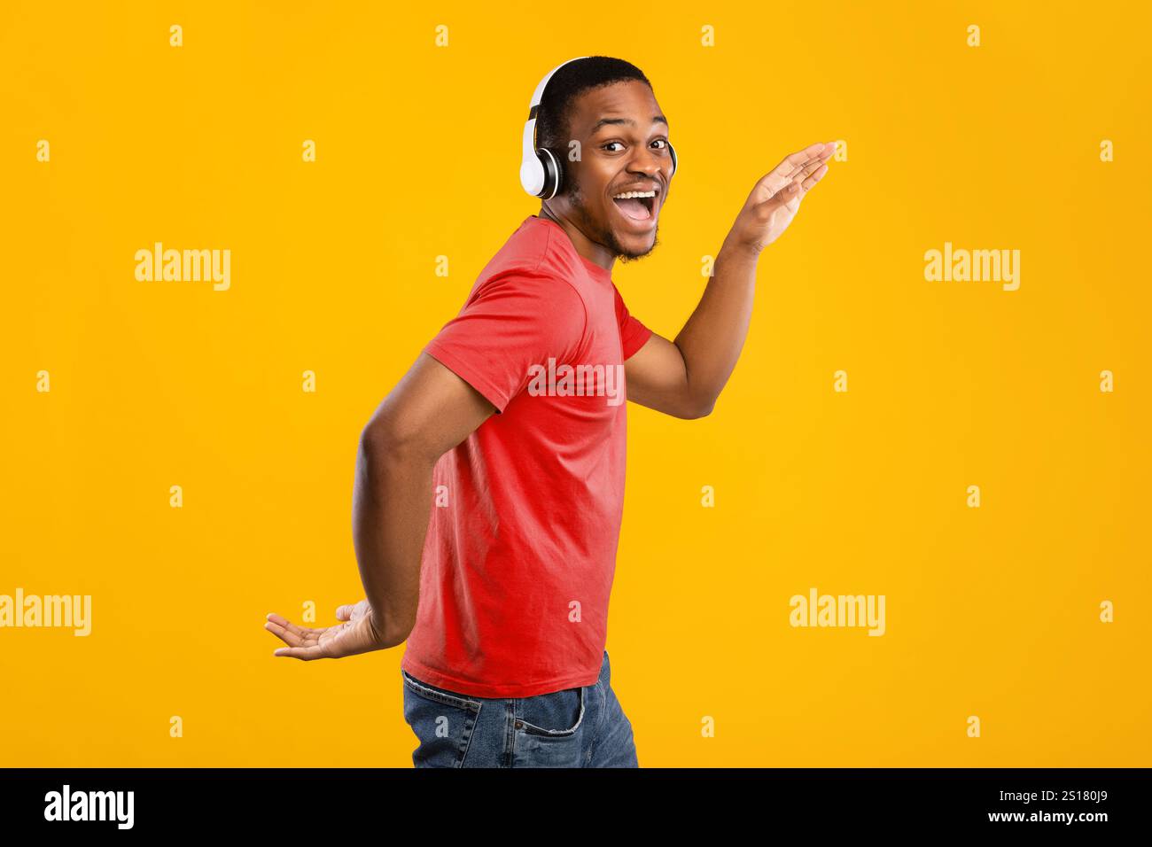 Funny African Guy Dancing Listening Music Wearing Headphones, Yellow ...