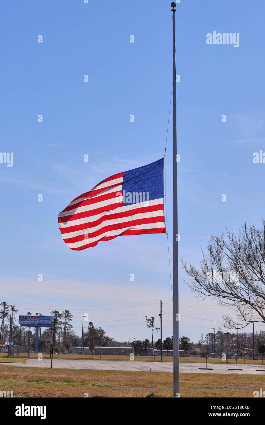 The United States flag flying at half mask outside the Town Hall in ...