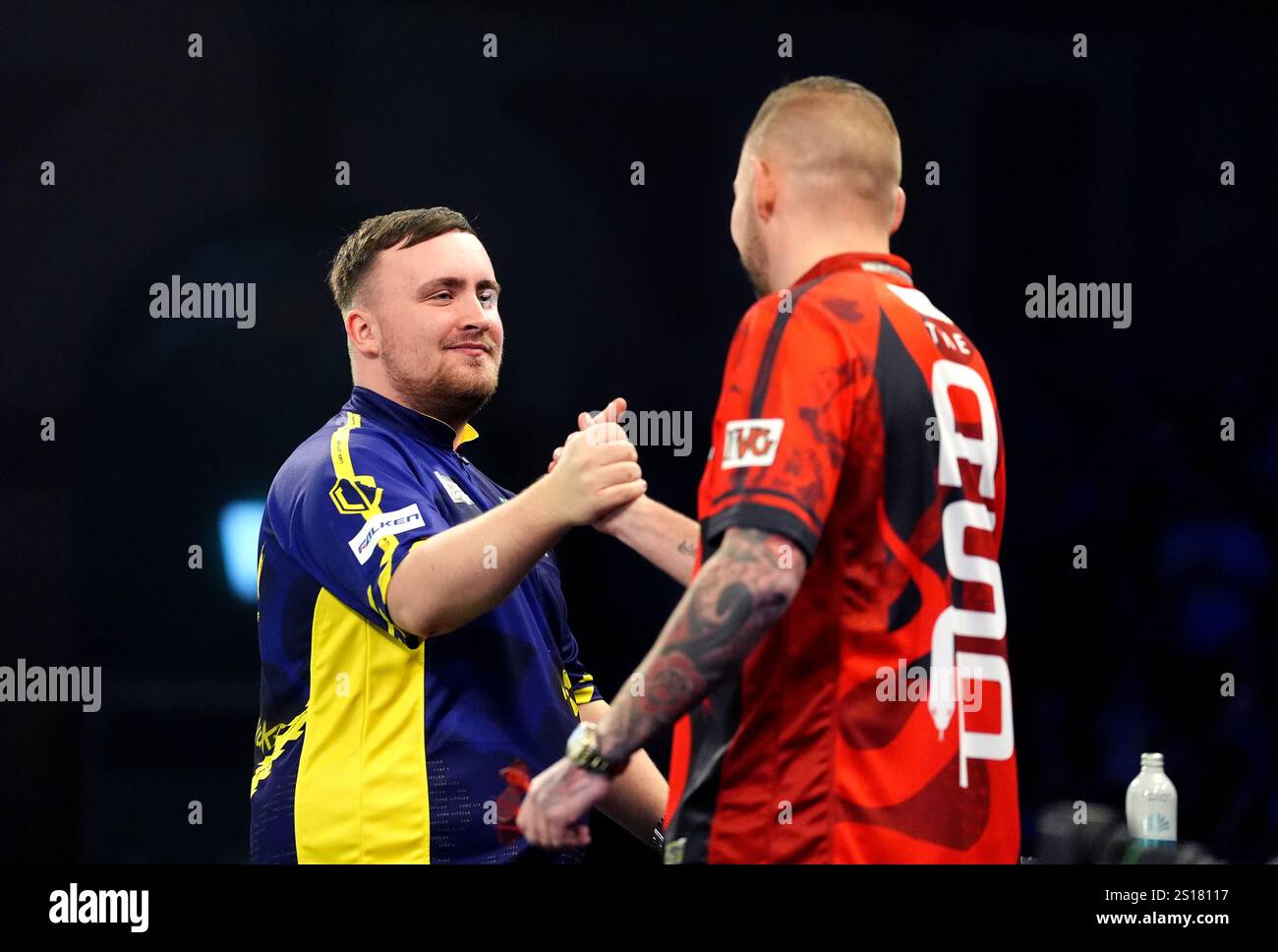 Luke Littler greets Nathan Aspinall ahead of their quarter-final match ...