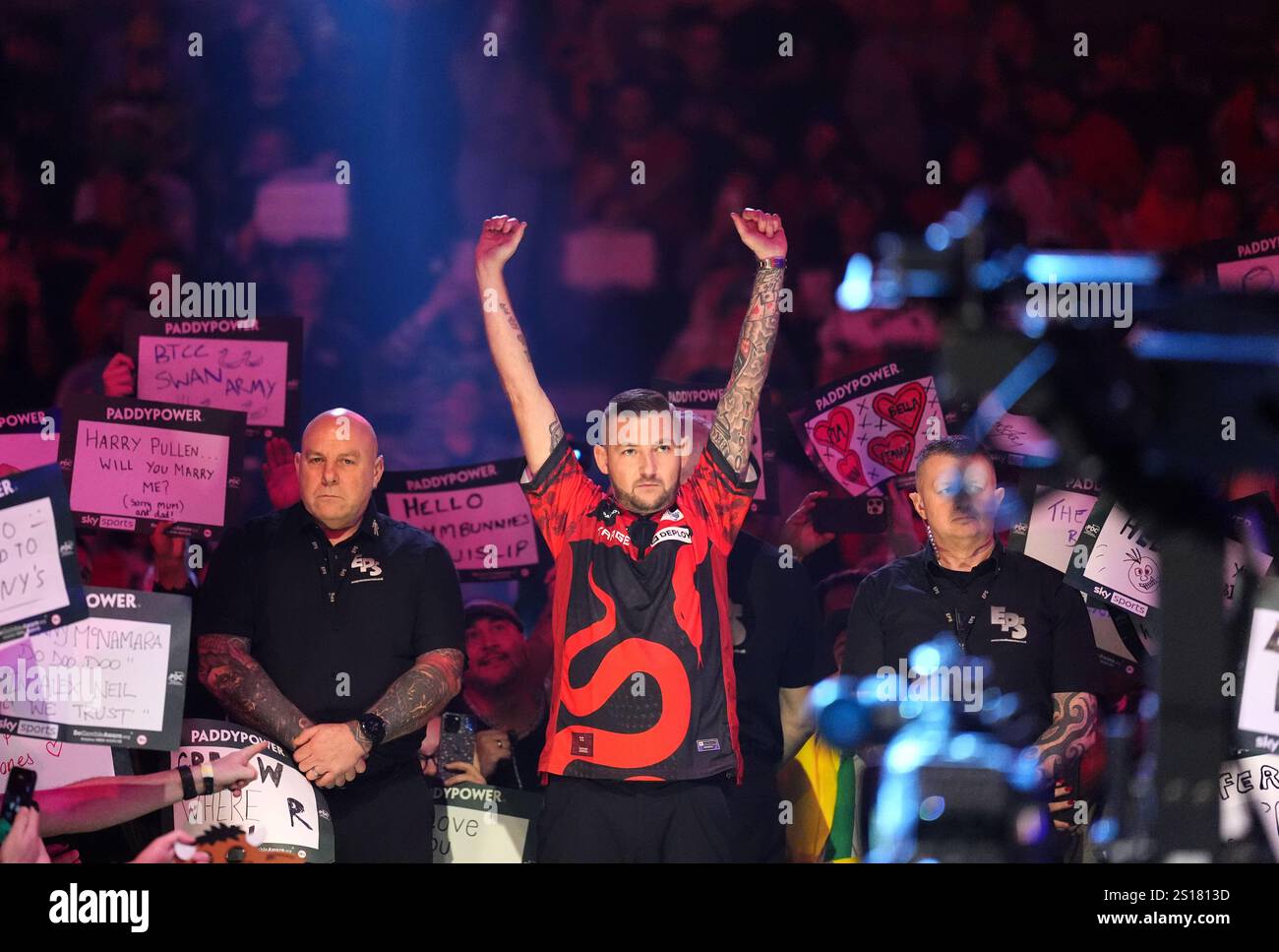Nathan Aspinall walks on ahead of the quarter-final match against Luke ...
