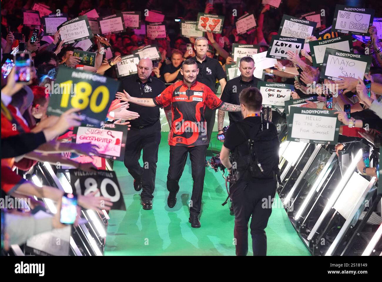 Nathan Aspinall walks on ahead of the quarter-final match against Luke ...