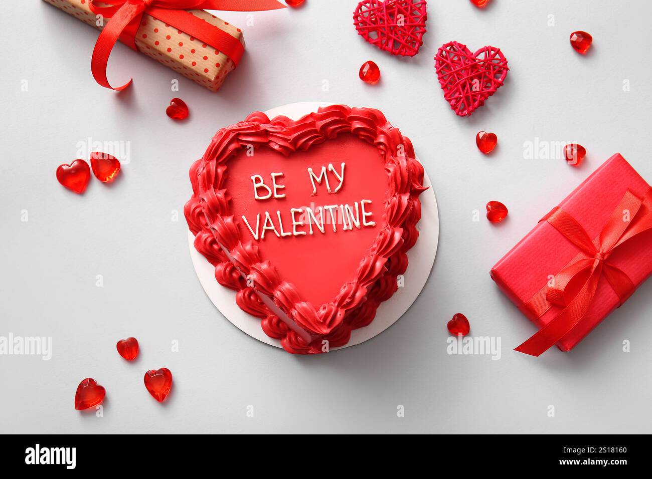 Sweet bento cake with gift boxes and hearts on grey background ...