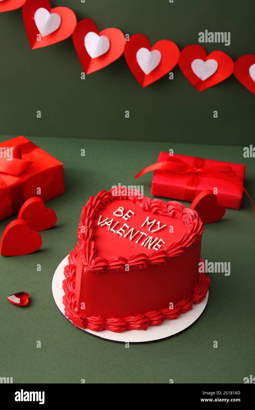 Sweet bento cake with gift boxes and paper garland in shape of heart on ...