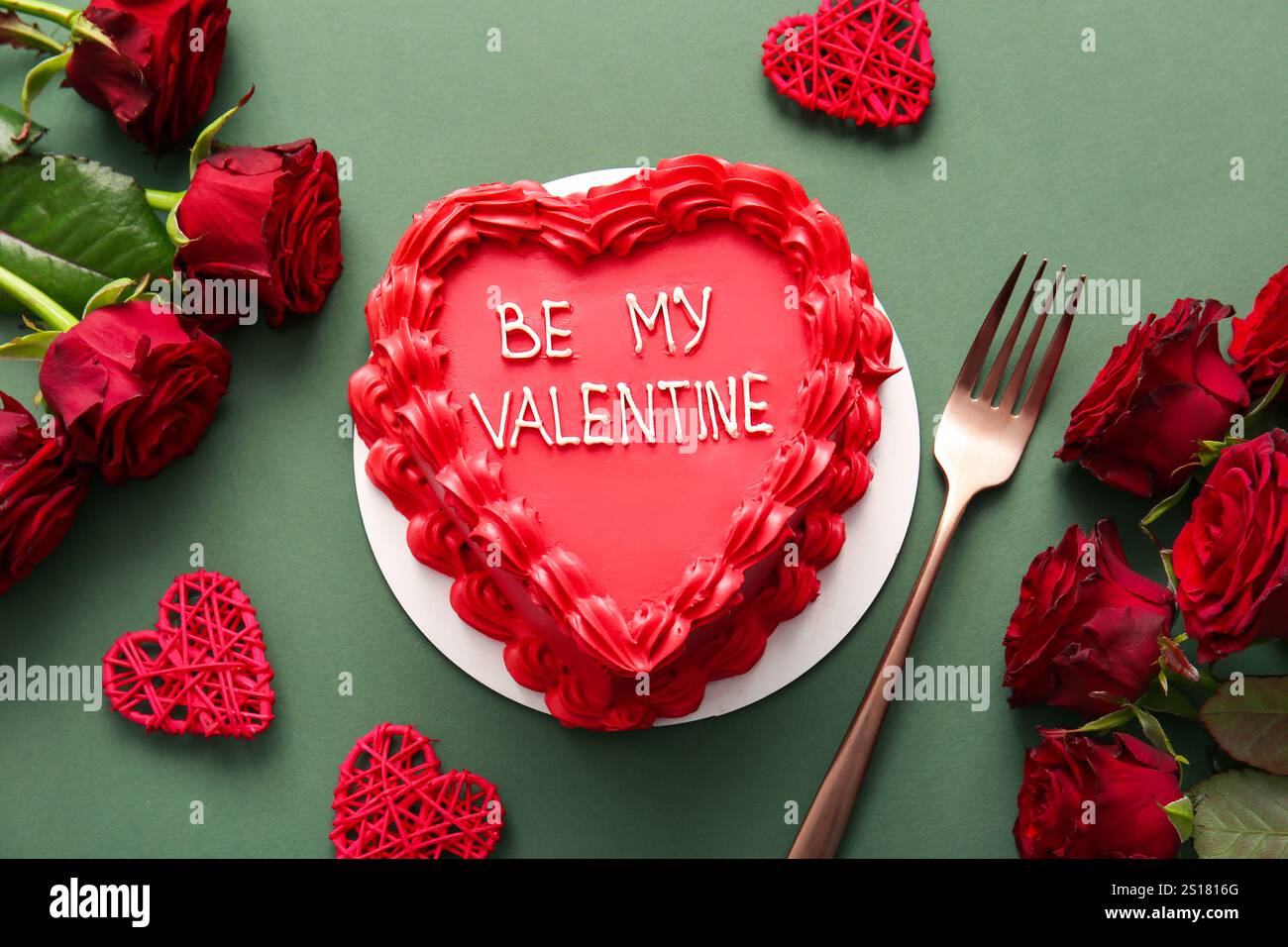 Sweet bento cake with beautiful red roses and hearts on green ...