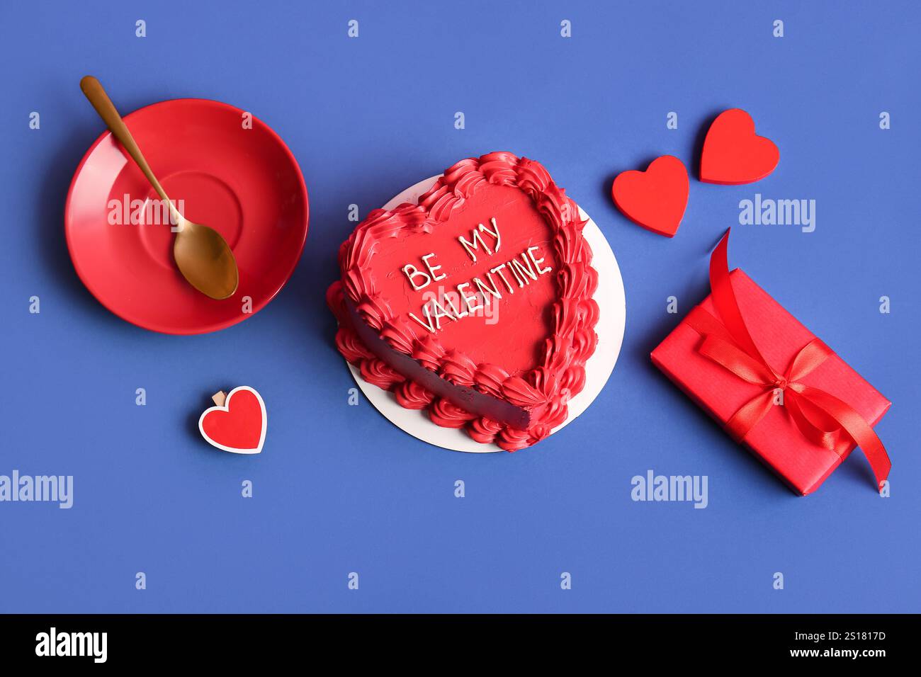 Sweet bento cake with gift box and hearts on blue background. Valentine ...