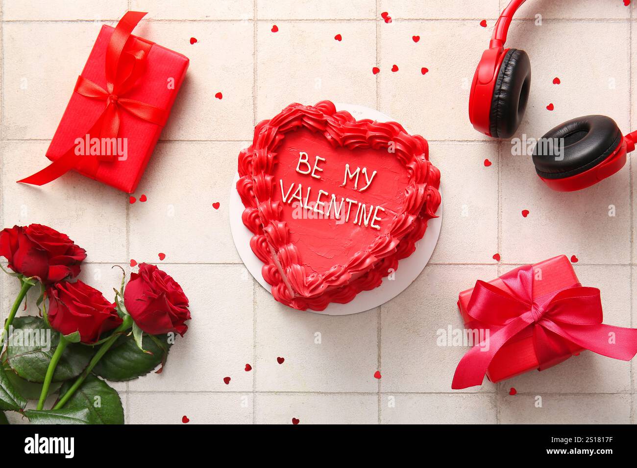 Sweet bento cake with gift boxes, headphones and red roses on white ...