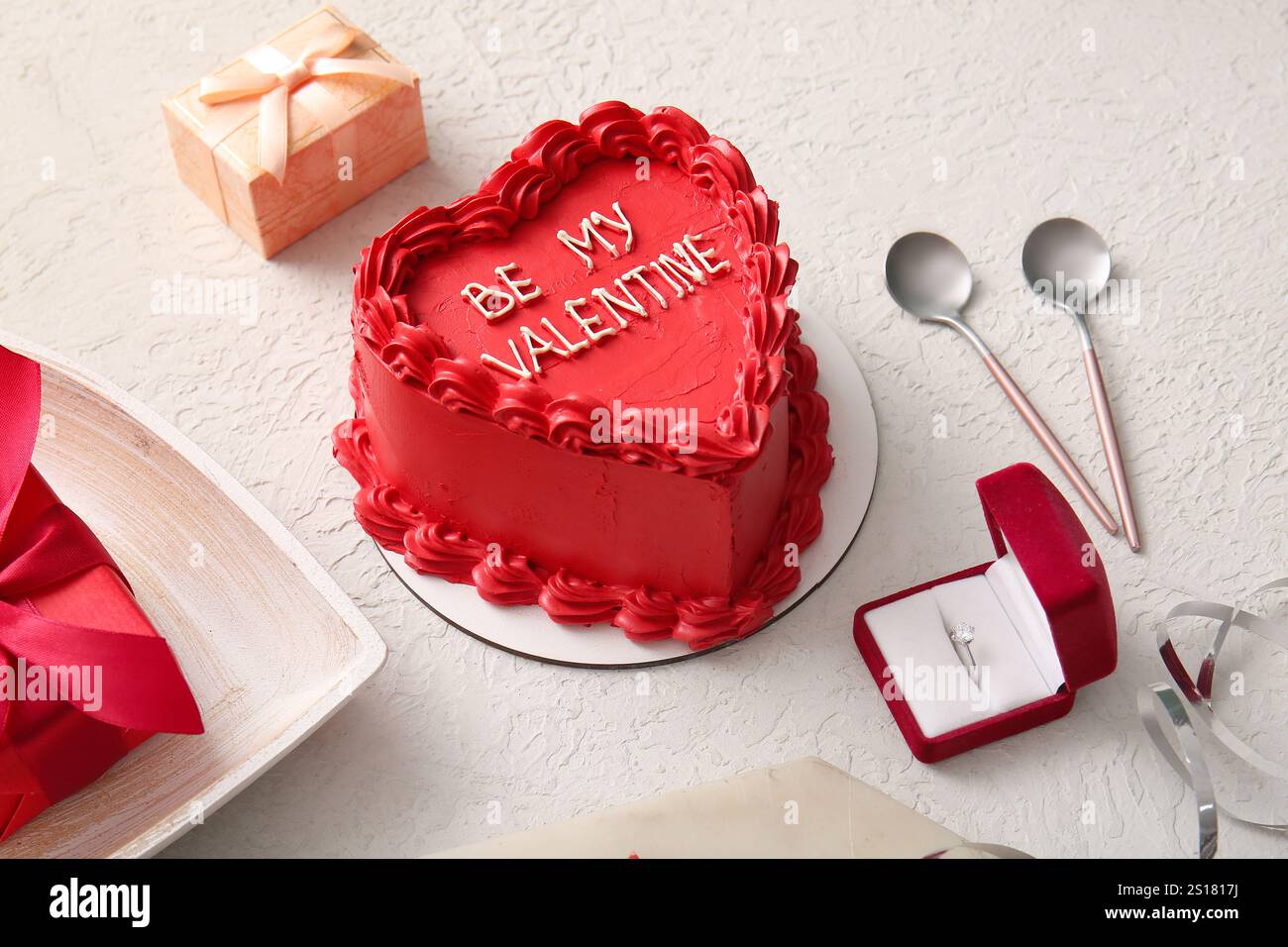 Sweet bento cake with gift boxes and engagement ring on white ...