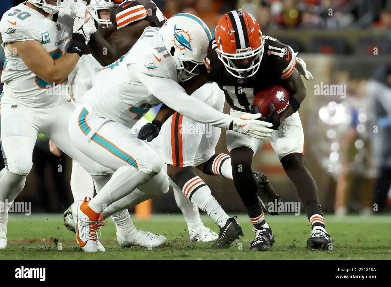 Miami Dolphins linebacker Channing Tindall (41) tackles Cleveland ...