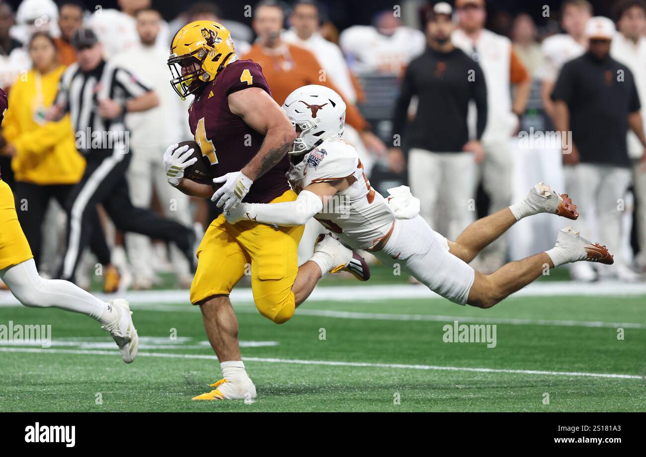 Arizona State running back Cam Skattebo (4) is tackled by Texas ...