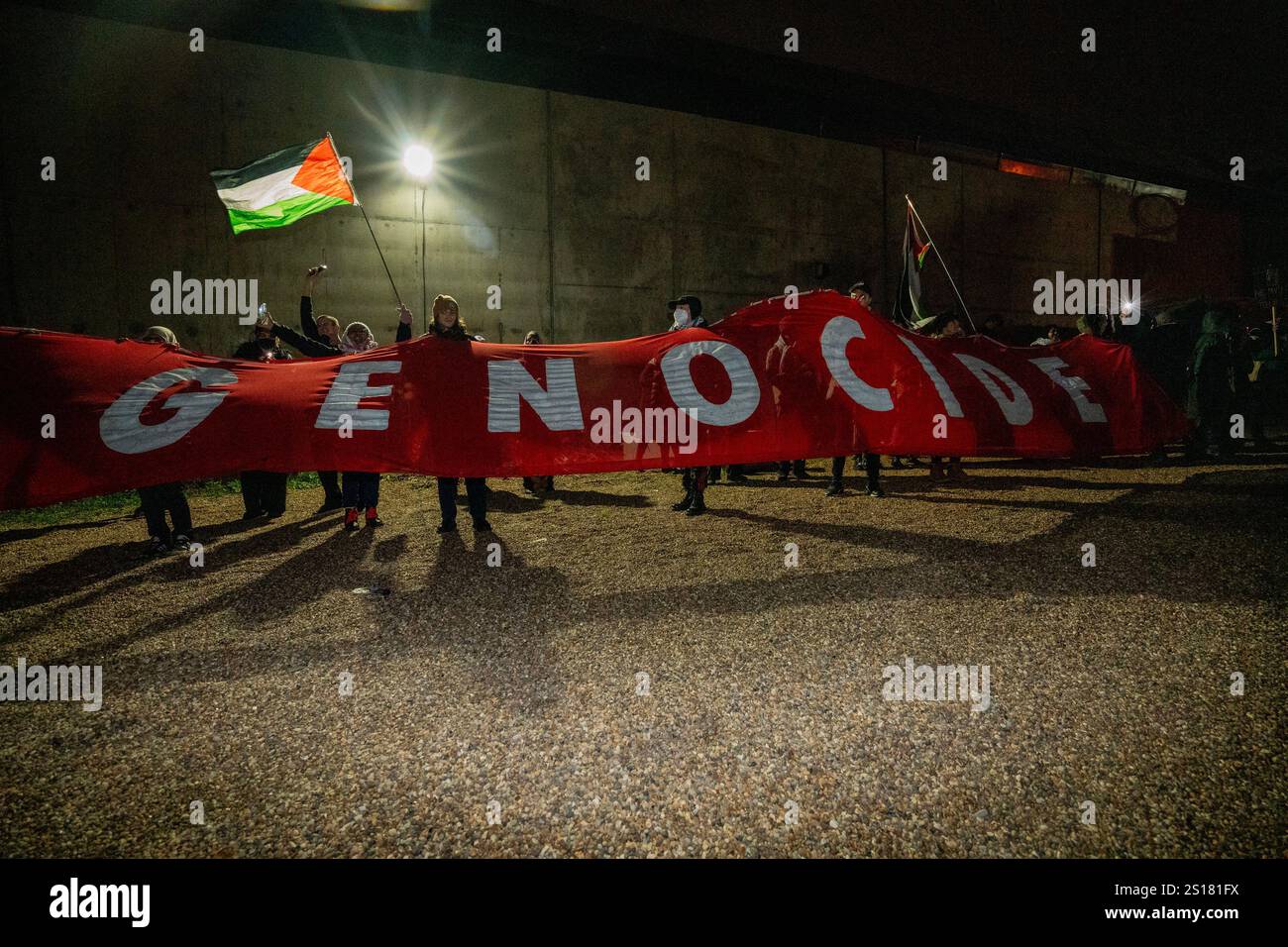 "Palestine Action" activists with a banner break into a compound ...