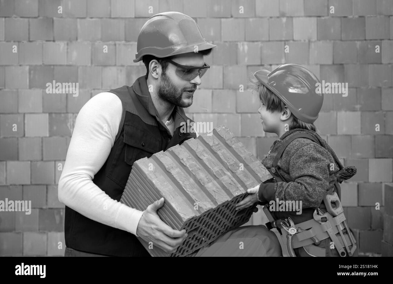 Brother helping at workshop. Bricklayer make masonry, builder work with ...