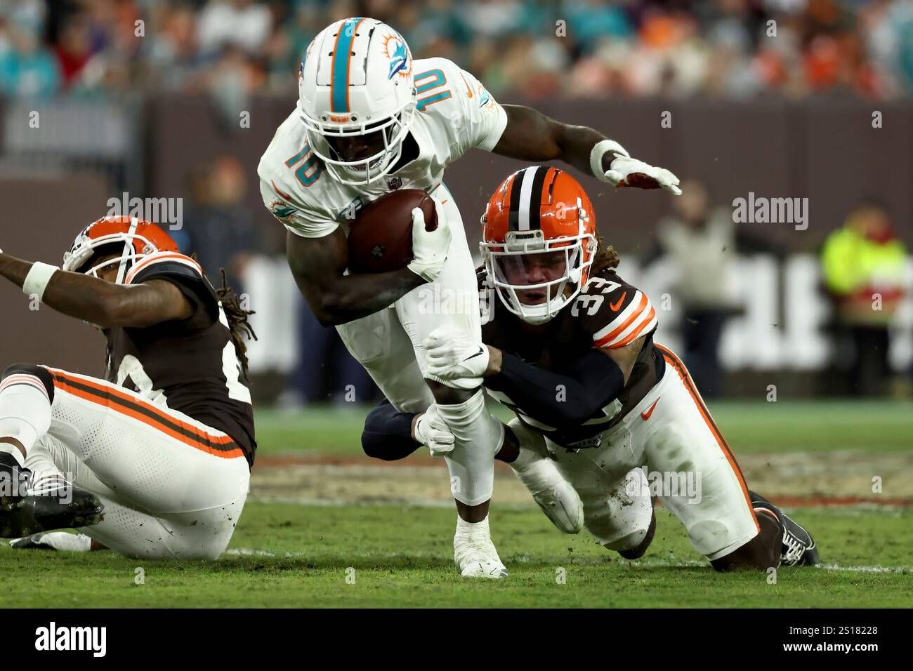 Cleveland Browns safety Ronnie Hickman (33) tackles Miami Dolphins wide ...