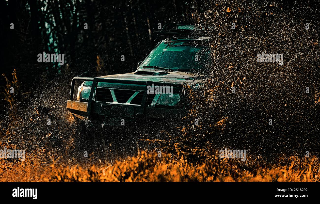 Mud and water splash in off-road racing. Drag racing car burns rubber ...