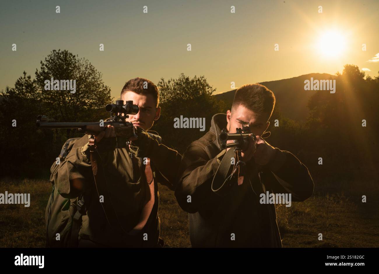 Rifle Hunter Silhouetted in Beautiful Sunset. Most realistic hunting ...