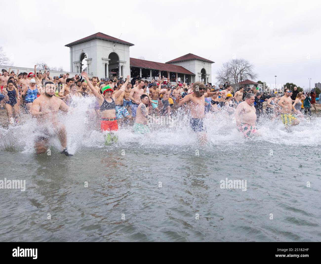 Toronto, Canada. 1st Jan, 2025. Participants rush into Lake Ontario ...