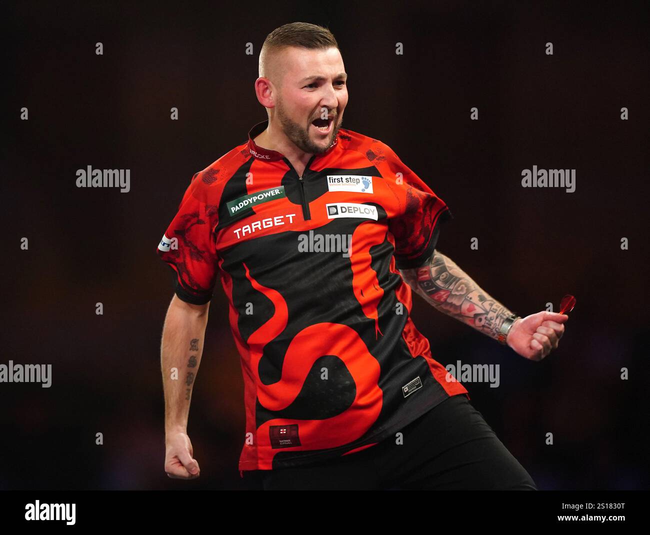 Nathan Aspinall reacts in the quarter-final match against Luke Littler ...