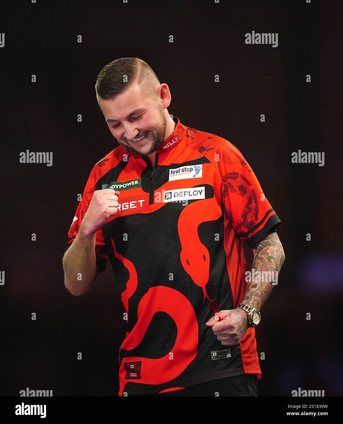 Nathan Aspinall reacts in the quarter-final match against Luke Littler ...
